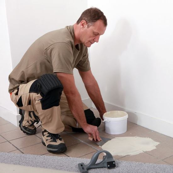 Construction: Carpet Laying (Adhesive Method)
